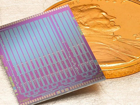 NIST voltage chip next to a penny