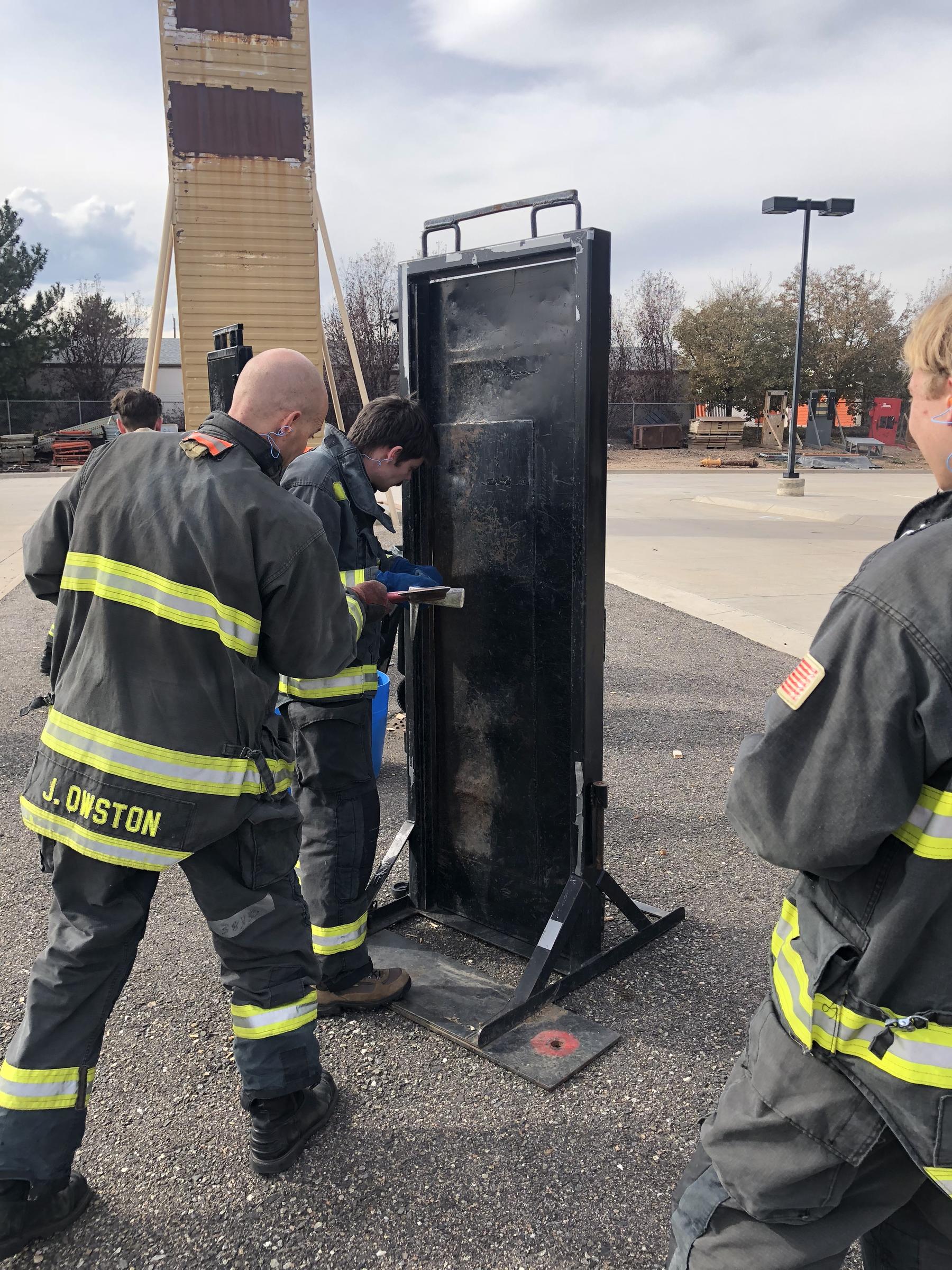 Breaking down doors firefighter training